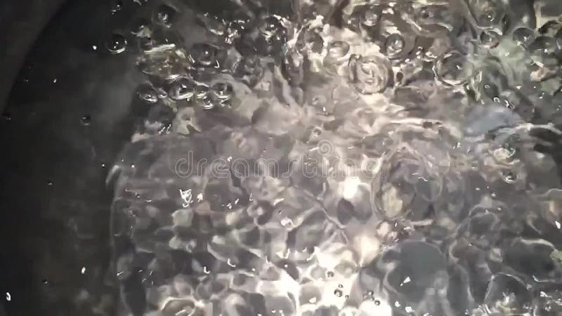 Bubbling water in a pot stock video. Video of object - 93654835
