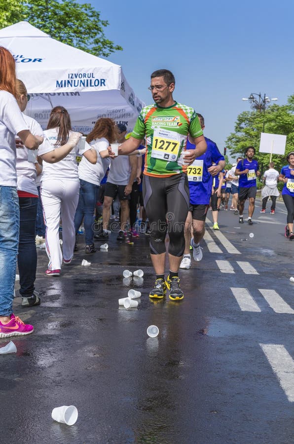 Marathon Runner Picking Up Water at Service Point Editorial Image ...