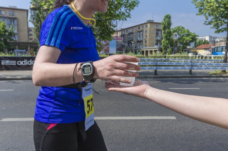 Runner Take a Water in a Marathon Race Editorial Stock Photo - Image of ...