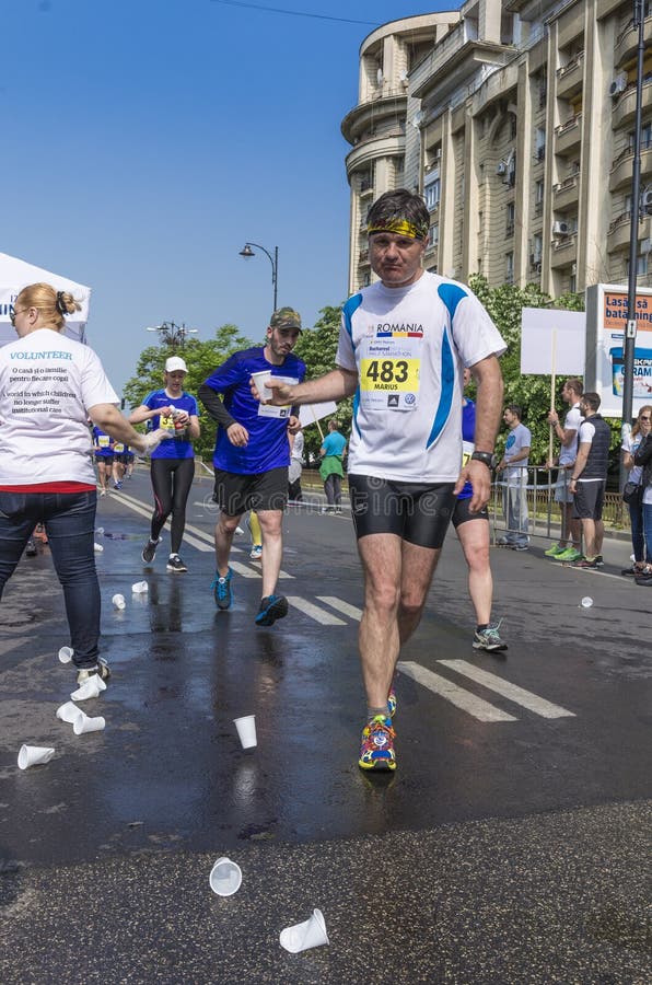 Marathon Runner Picking Up Water at Service Point Editorial Image ...