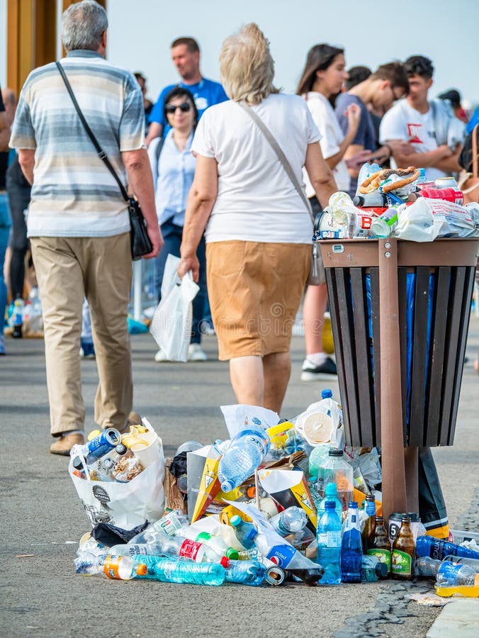 Garbage Bin Full of Trash. Overflowing Garbage Bin with Many People ...