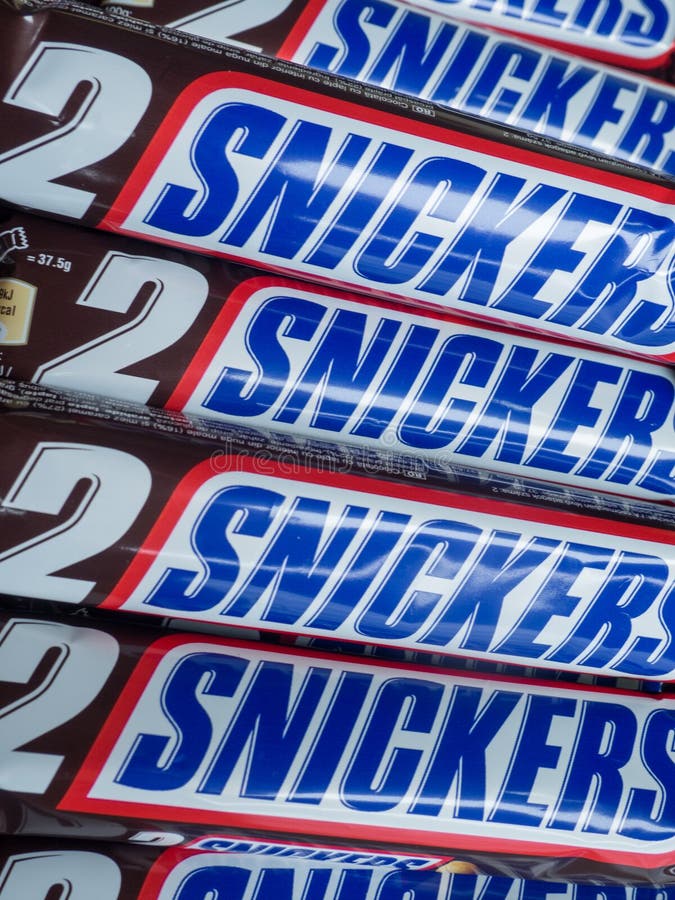Snickers chocolate bar editorial stock image. Image of deliciously ...