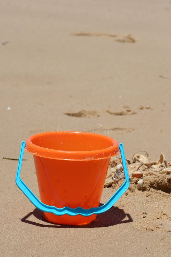 Bucket on Beach with Shells Stock Image - Image of coast, play: 1580539