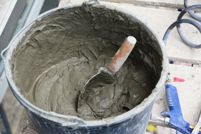 Bucket with Cement Mortar for Exterior Plastering of a House Stock ...