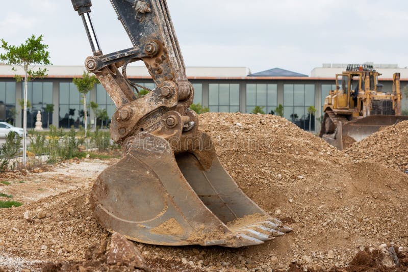 The Bucket of a Construction Machine Working in the Mud. Excavator ...