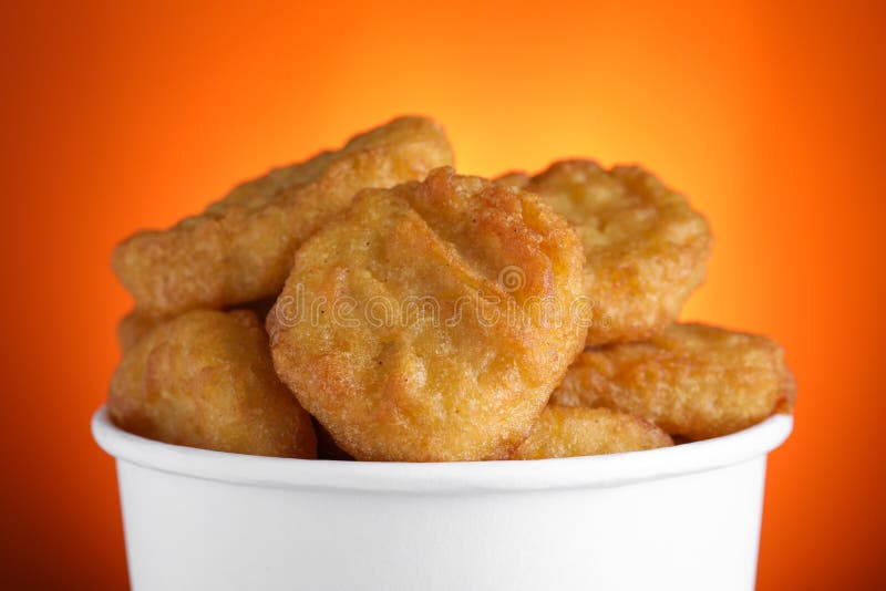 Bucket with Delicious Chicken Nuggets on Background, Closeup Stock ...