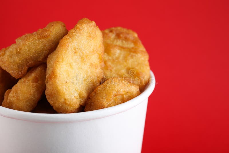 Bucket with Delicious Chicken Nuggets on Background, Closeup Stock ...