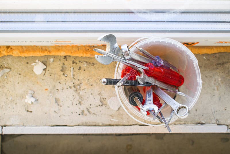 Bucket with Tools for Repair on a Window Sill Stock Photo - Image of ...