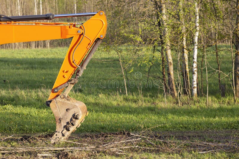 Bucket Excavator Clearing the Road in the Forest Stock Photo - Image of ...