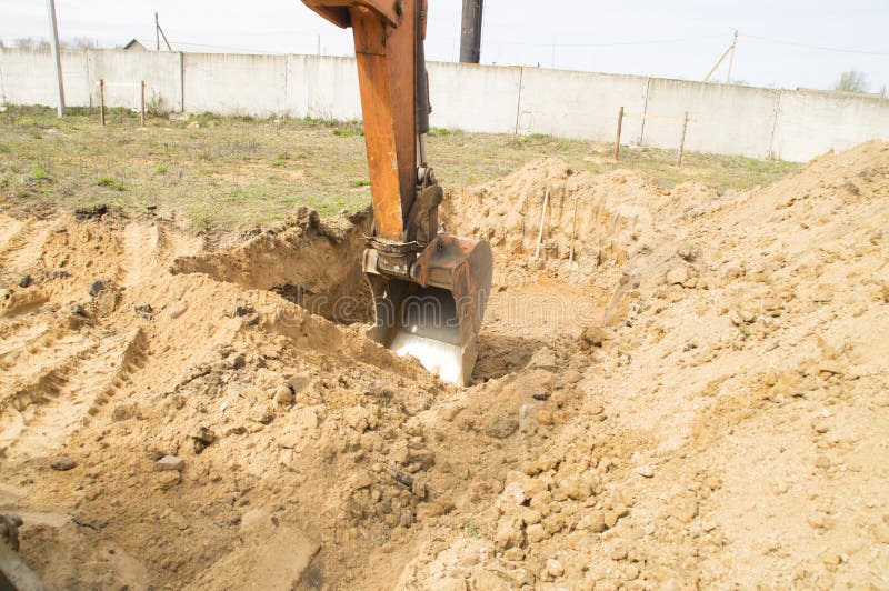Bucket Excavator Digging a Deep Hole Stock Photo - Image of soil ...
