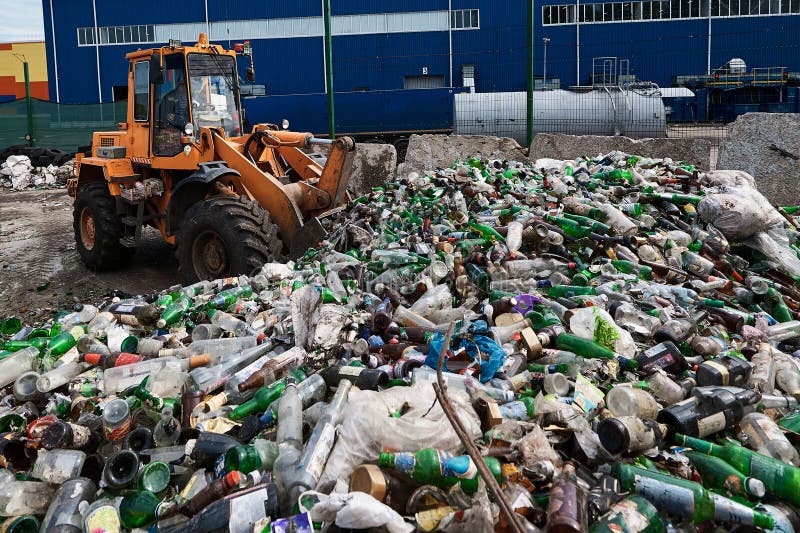 The Bucket Loader Breaks Glass Bottles by Dumping Them Out of the ...