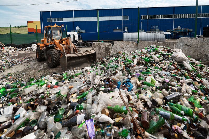 The Bucket Loader Breaks Glass Bottles by Dumping Them Out of the ...