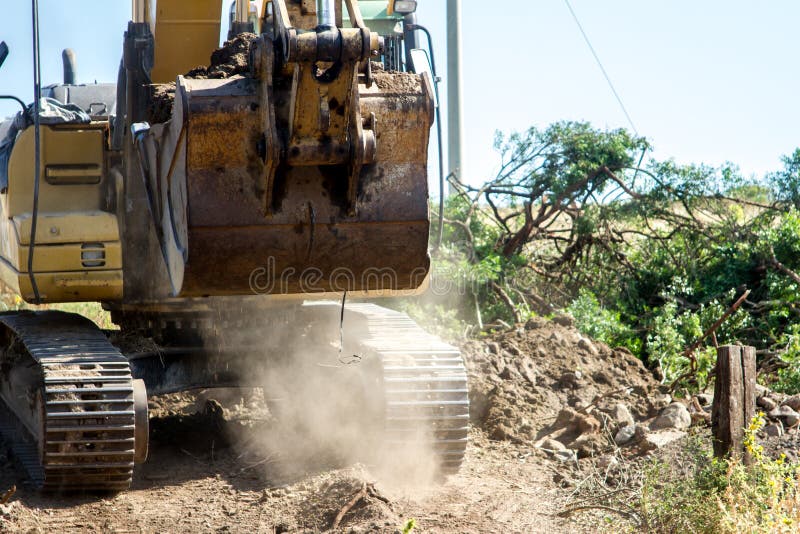 Bucket and Mechanical Arm of the Excavator in Motion Stock Photo ...