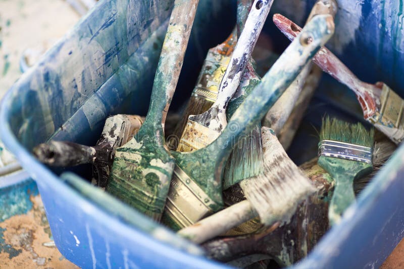 A Bucket of Paint Brushes stock image. Image of renovate - 71780425