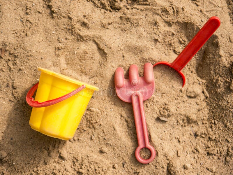 Bucket, Puddle and Rake in Kid`s Sandbox Top View Stock Image - Image ...