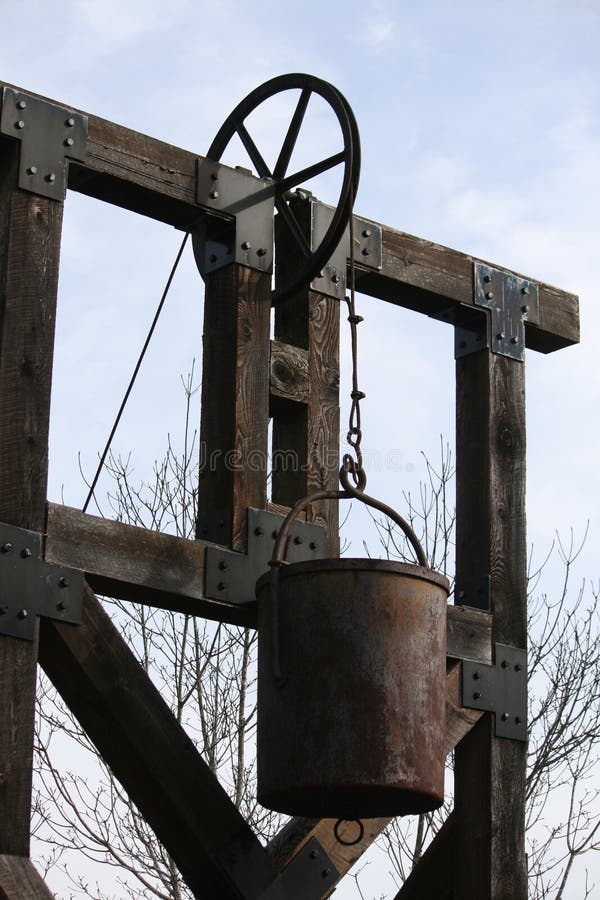 Pulley and bucket stock photo. Image of machinery, lift - 70040034