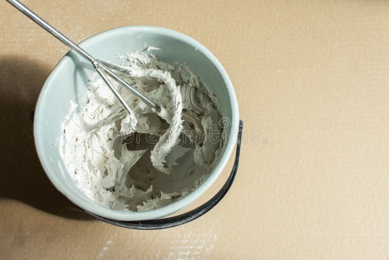 Bucket with ready putty stock photo. Image of overhauls - 145843010