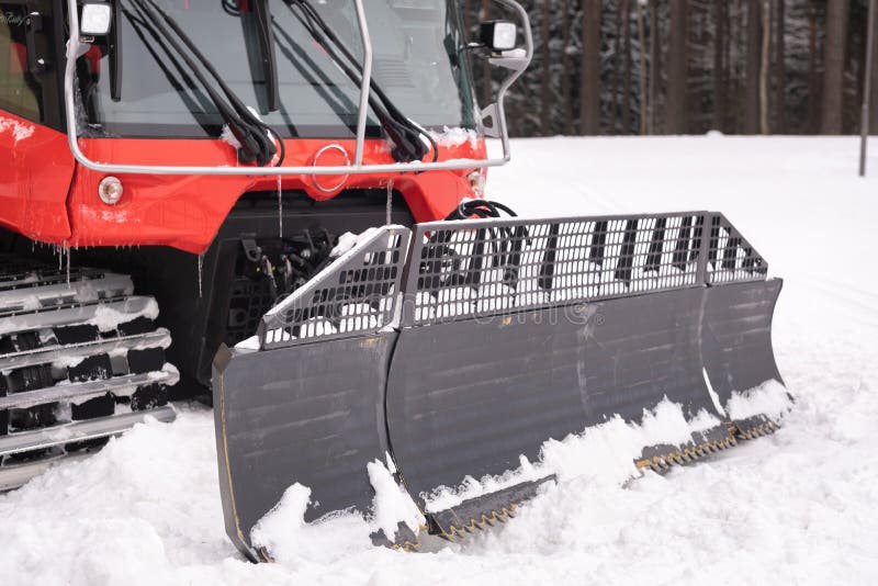The Bucket of a Snowplow on Tracks, Standing in the Forest in Winter ...