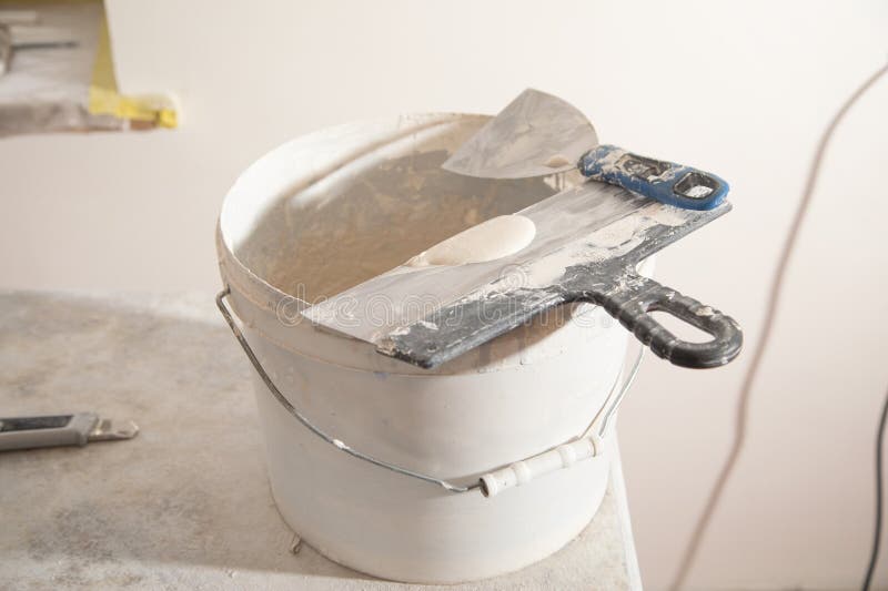 Bucket with a Spatula for Leveling Stock Photo - Image of building ...