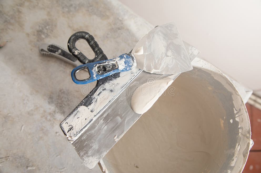 Bucket with a Spatula for Leveling Stock Photo - Image of improvement ...