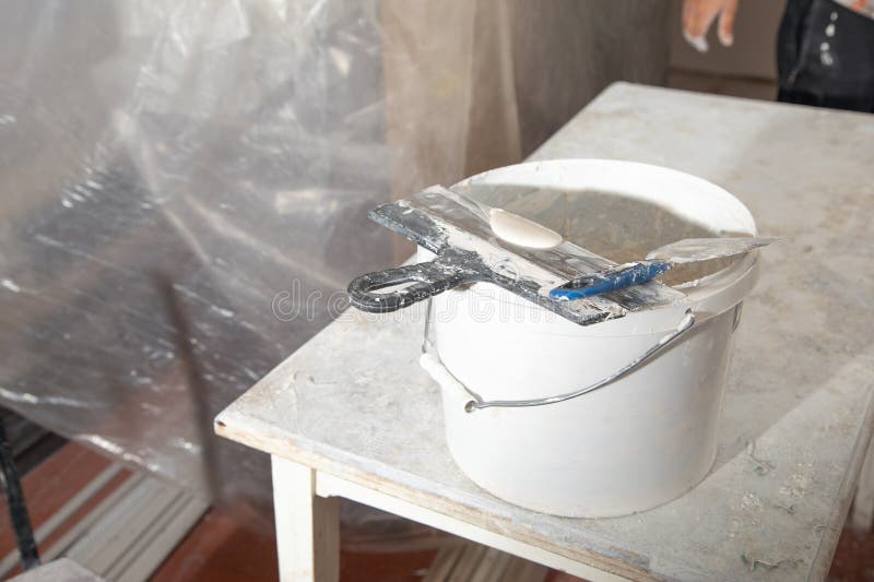 Bucket with a Spatula for Leveling Stock Photo - Image of building ...