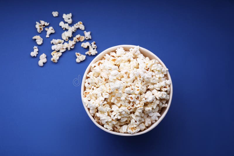 Bucket of Tasty Popcorn on Blue Background, Flat Lay Stock Image ...