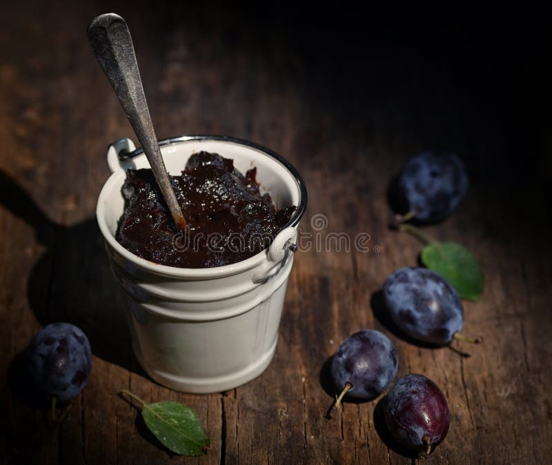 Bucket of Thick Plum Jam stock photo. Image of leaf - 196215418