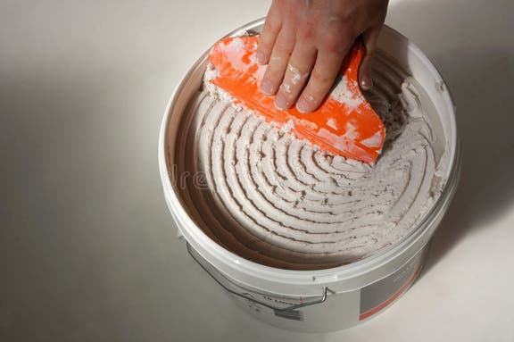 Bucket of tile adhesive stock image. Image of interior - 5227069