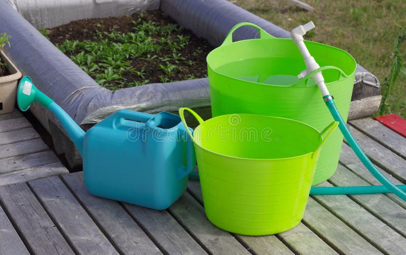 Bucket, Watering Can, these are All Containers for Watering Stock Photo ...