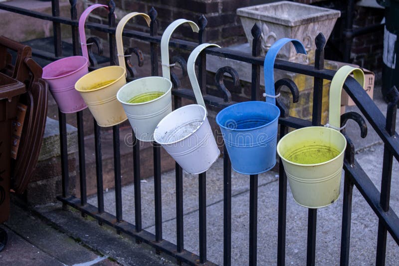 Buckets Hanging on a Metal Fence Stock Image - Image of hanging, metal ...