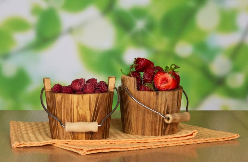 Buckets with Raspberry and Strawberry Stock Image - Image of napkin ...