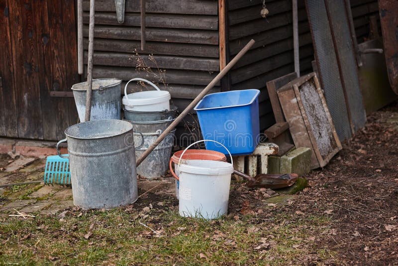 Buckets and Tools by the Shed on a Farmstead Backyard Stock Image ...