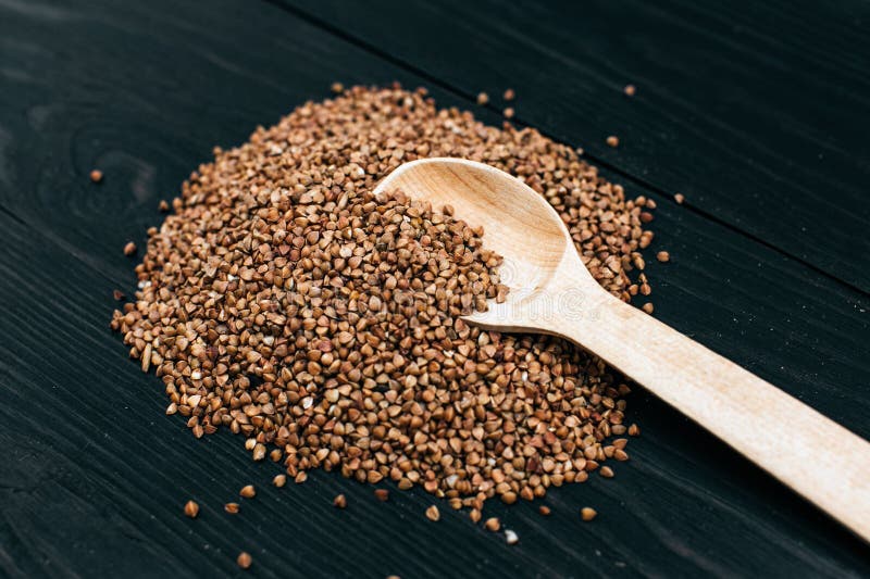 Buckwheat Grains on a Dark Wooden Table Stock Photo - Image of healthy ...