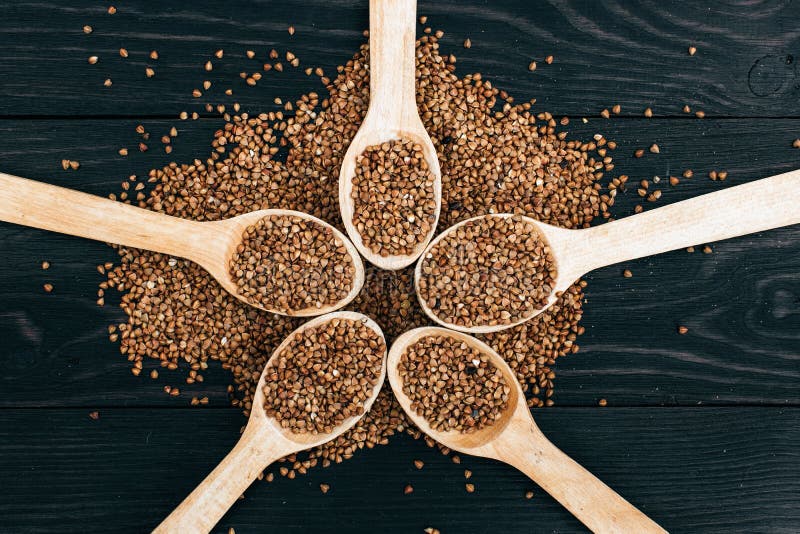 Buckwheat Grains on a Dark Wooden Table Stock Image - Image of group ...