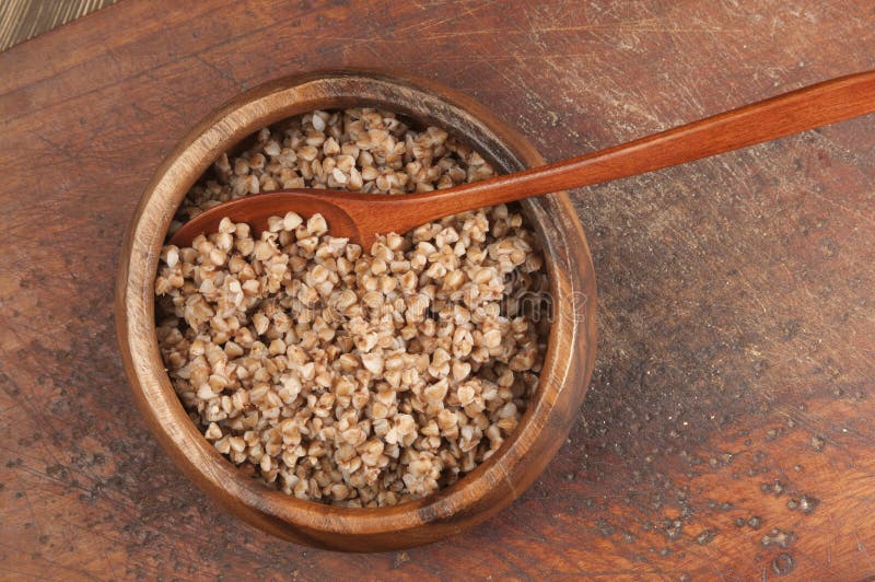 Buckwheat kasha in a bowl stock photo. Image of wooden - 37227734