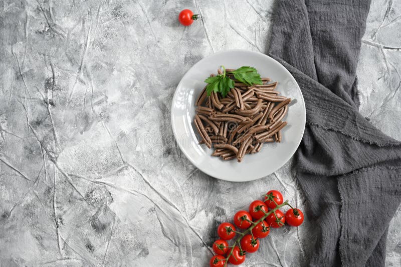 Buckwheat Spaghetti. Buckwheat Pasta on a Light Grey Table Stock Image ...