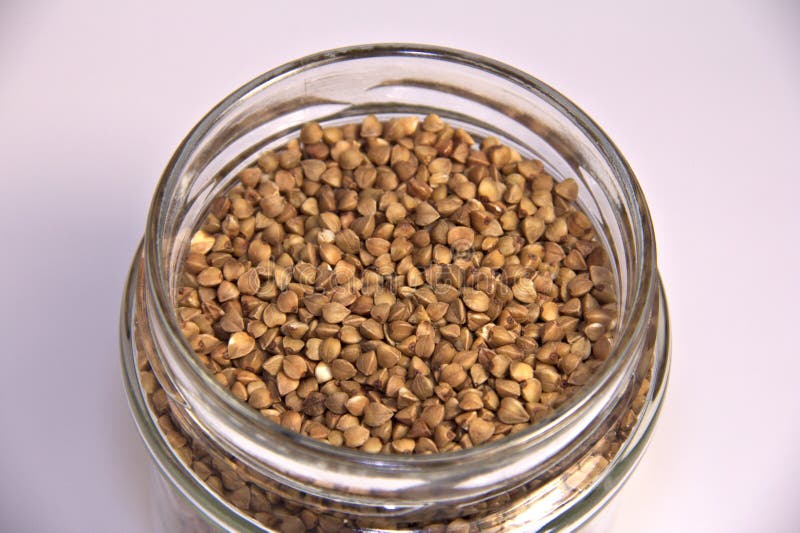 Buckwheat in a Transparent Jar. on a Gray Background. Top View Stock ...