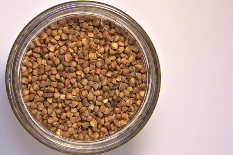 Buckwheat in a Transparent Jar. on a Gray Background. Top View Stock ...