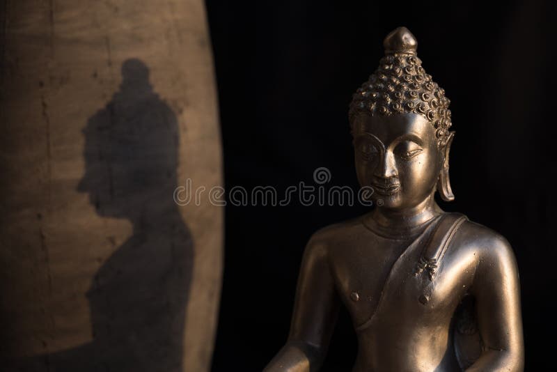 Buddha with Shadow in Light Stock Photo - Image of bronze, orient: 62643802