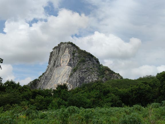 Buddha Statue Carved into a Cliff Face Stock Photo - Image of plateau ...