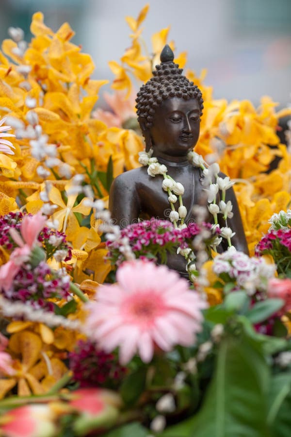 Buddha statue with flower stock image. Image of southeast - 53900355