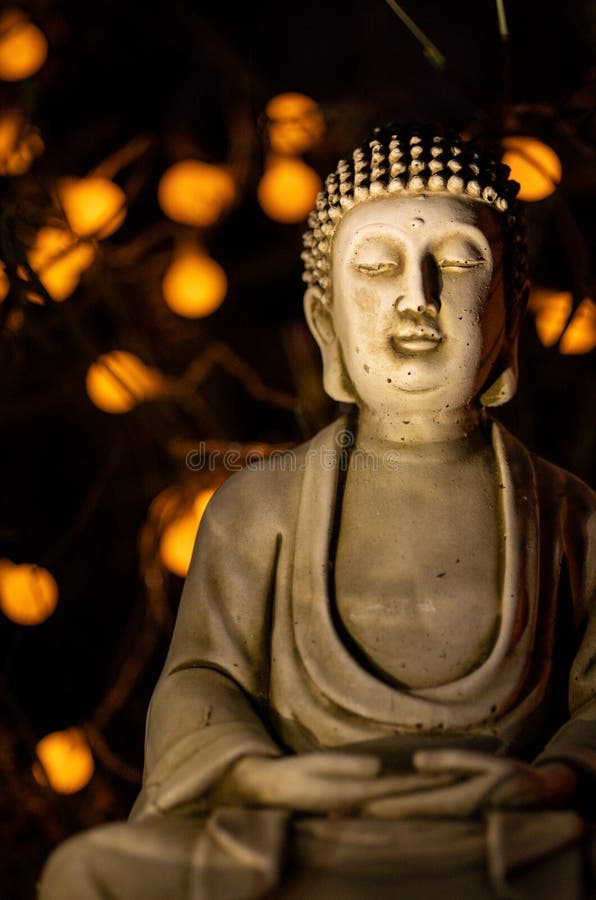 Buddha Statue at Night with Lights. Figure with Hands Together in ...