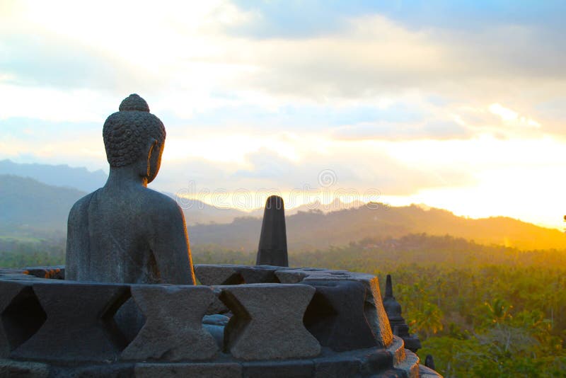 Buddha Statue Watching the Sunset Over Borobodur Temple Stock Photo ...