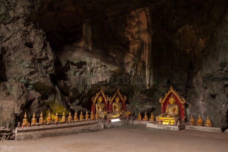 Buddha statues in a cave stock image. Image of religion - 34112445
