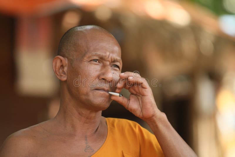 Buddhist Monk Smoking a Cigarette Editorial Stock Photo - Image of ...