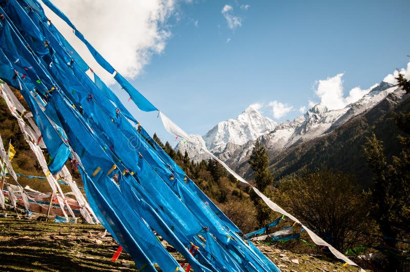 Buddhist Prayer Flags in Front of Snowy Mountains in Higlands O China ...