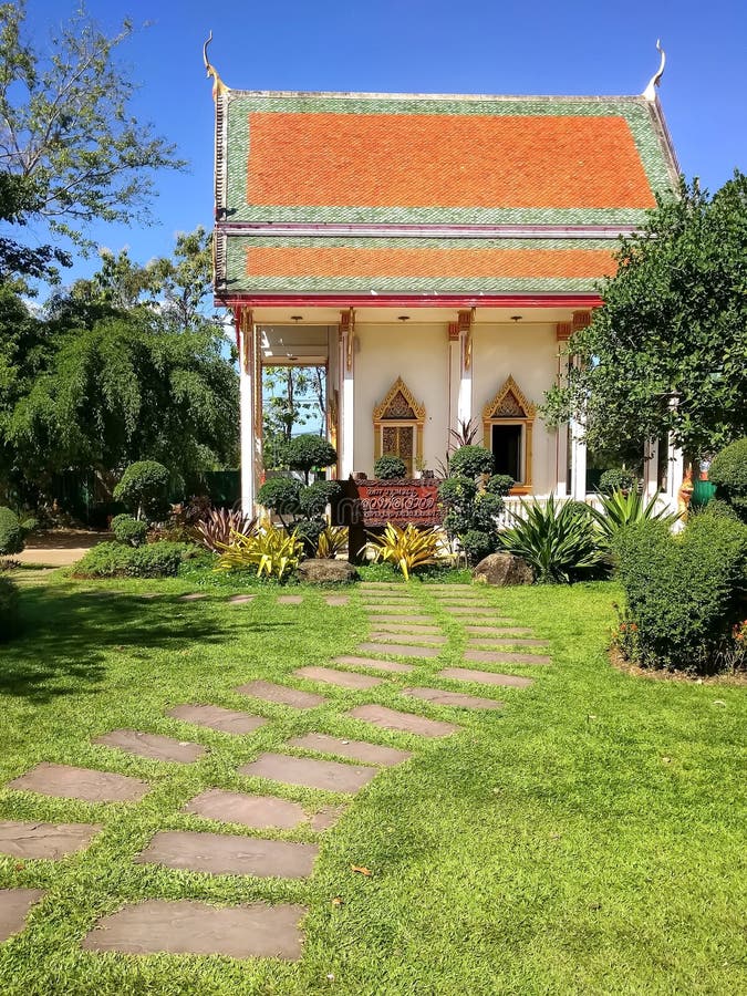 Buddhist Temple with Tiled Walkway and Green Grass, Thailand Stock ...