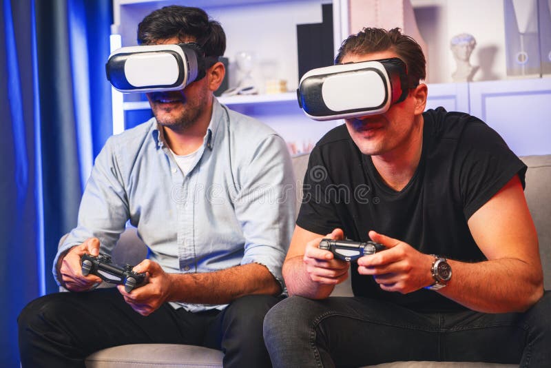Friend Gamers Playing Video Game Using Joysticks and VR Headset ...
