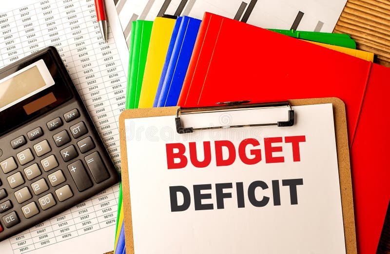 BUDGET DEFICIT Text Written on Paper Clipboard with Chart and ...