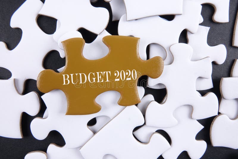Budget 2020 Printed on Gold Puzzle Over White Puzzle Background. Stock ...